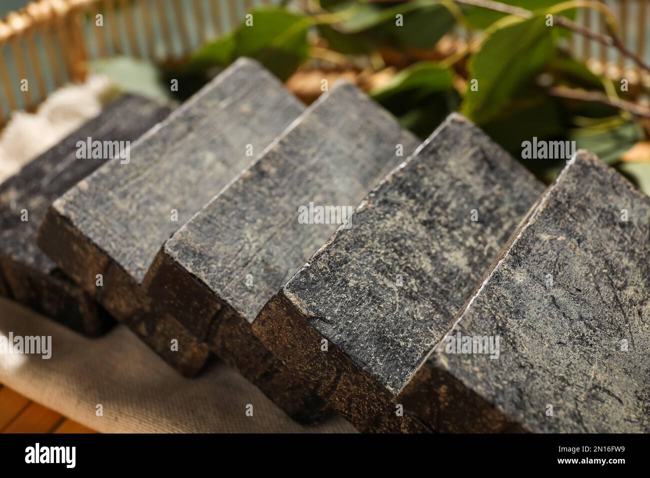 Natural tar soap in wicker basket, closeup Stock Photo - Alamy