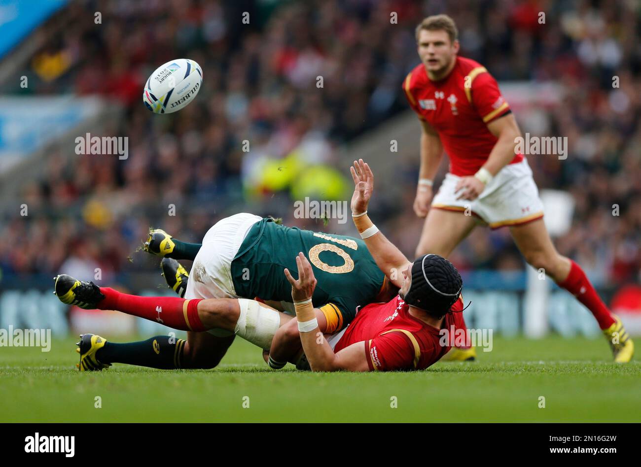 South Africa's Handre Pollard tackles Wales' Luke Charteris during the ...