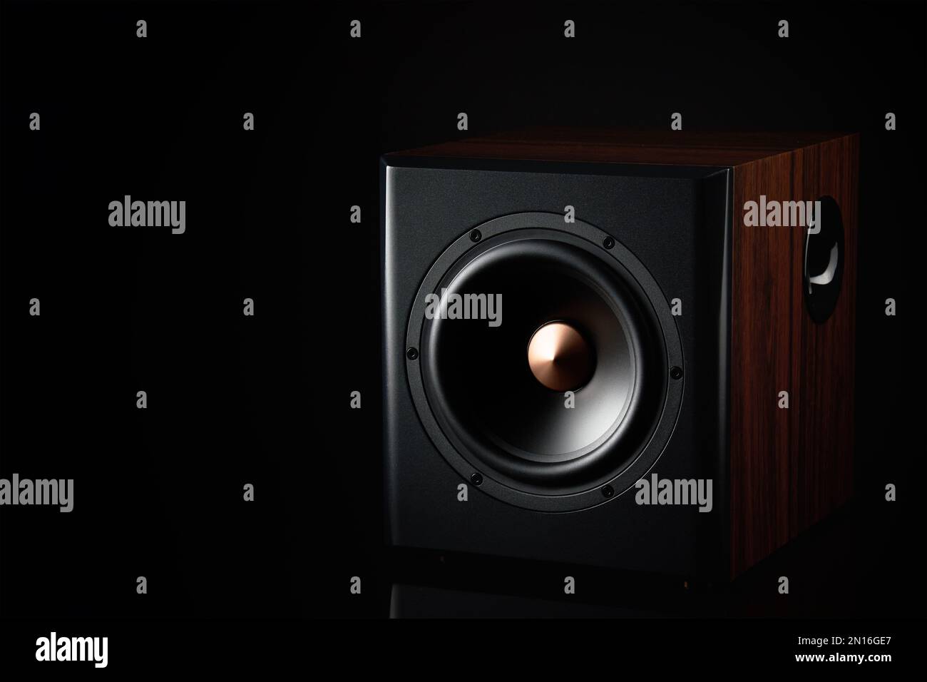 Sound speaker on dark background with copy space. Set for listening ...