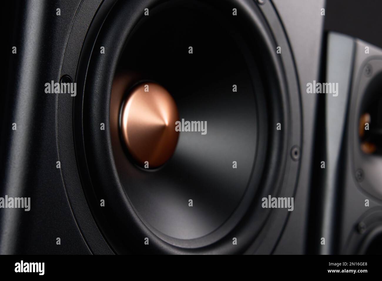 Sound speaker on dark background, close up. Set for listening music ...