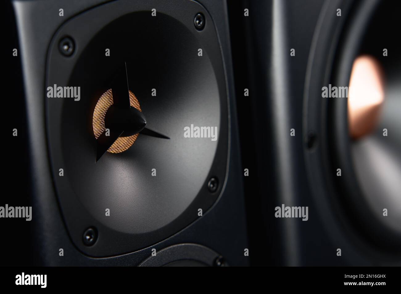 Sound speaker on dark background, close up. Set for listening music ...