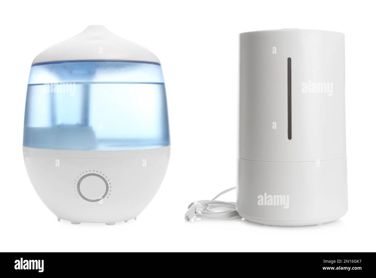 Two modern air humidifiers on white background Stock Photo - Alamy