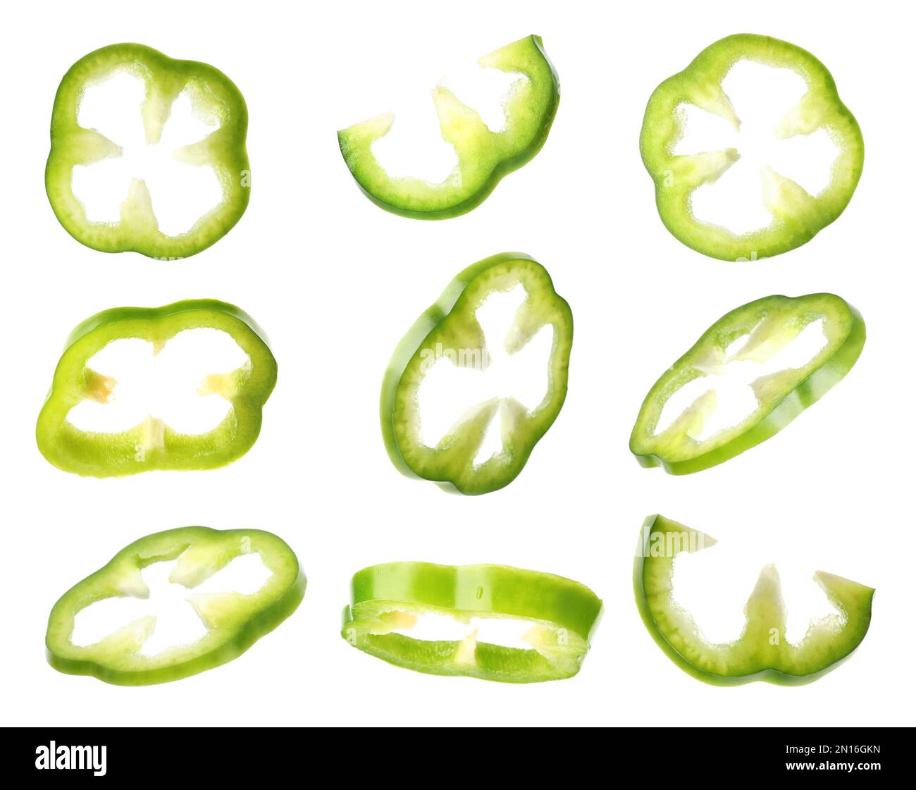 Set of green bell pepper slices isolated on white Stock Photo - Alamy