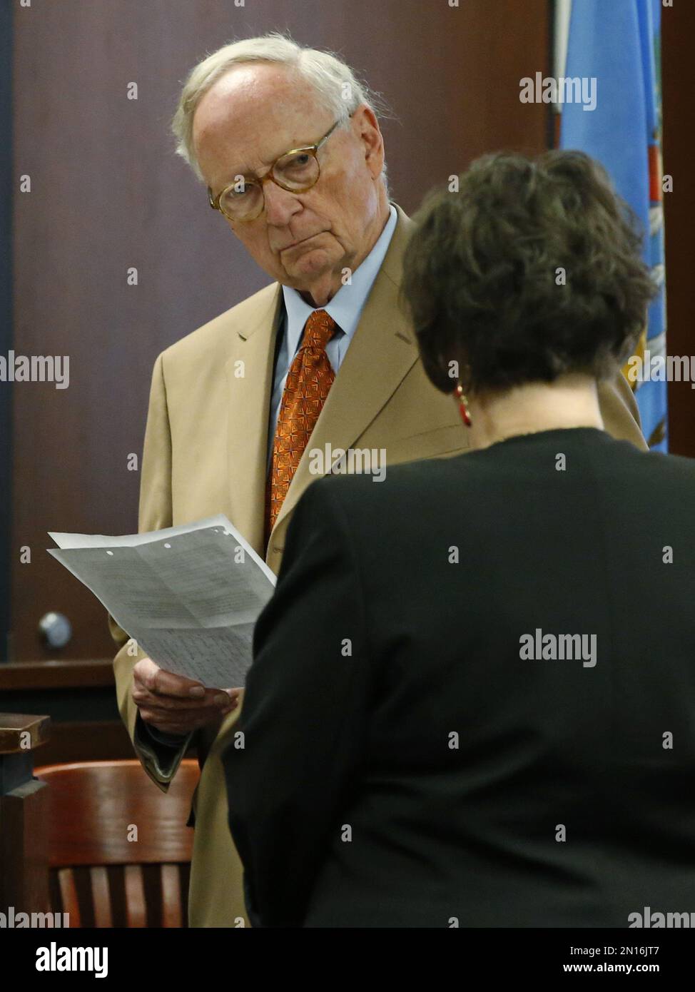 Atrorney Stephen Jones, rear, listens as Cathy Costello, front, widow ...