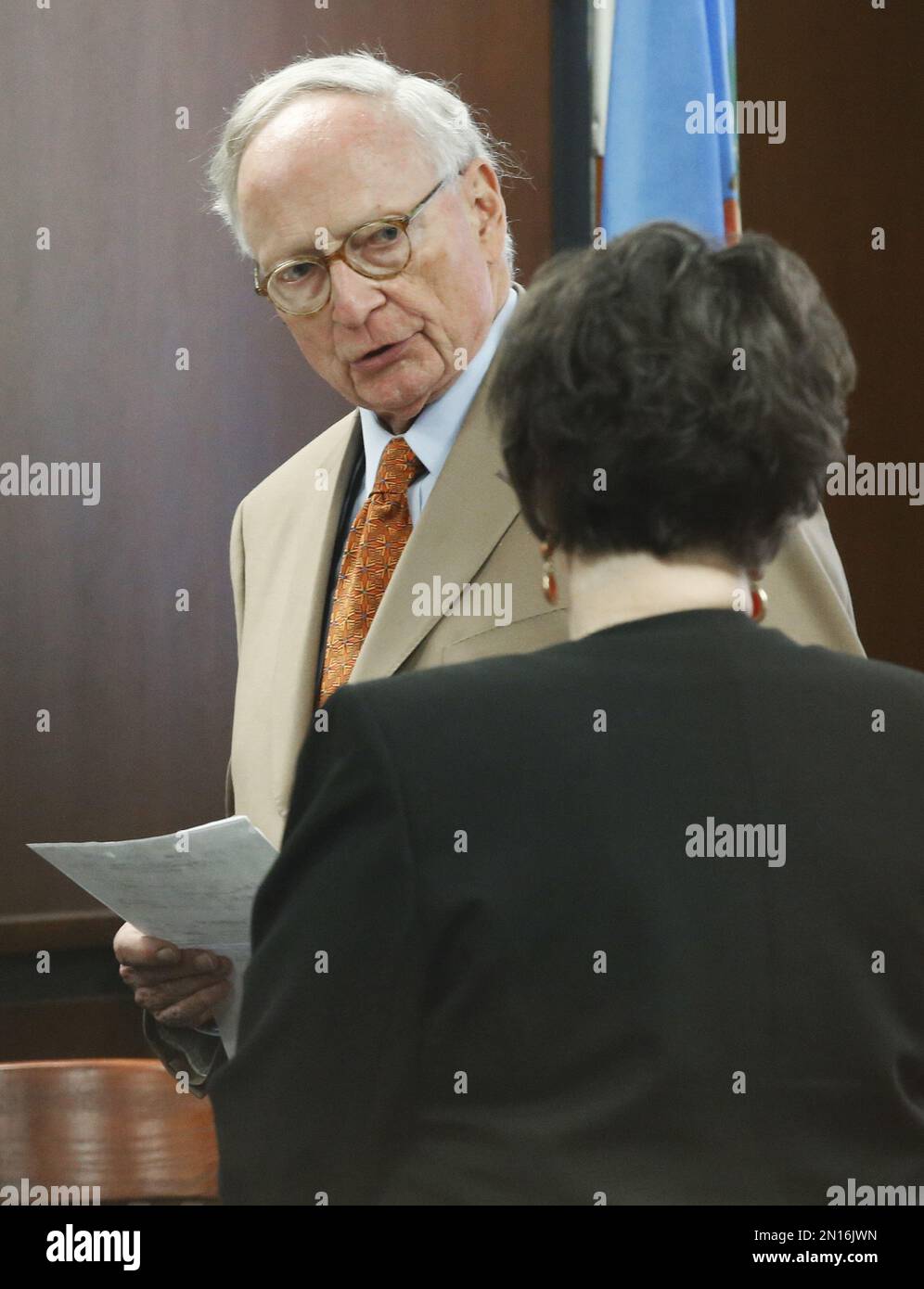 Atrorney Stephen Jones, rear, listens as Cathy Costello, front, widow ...