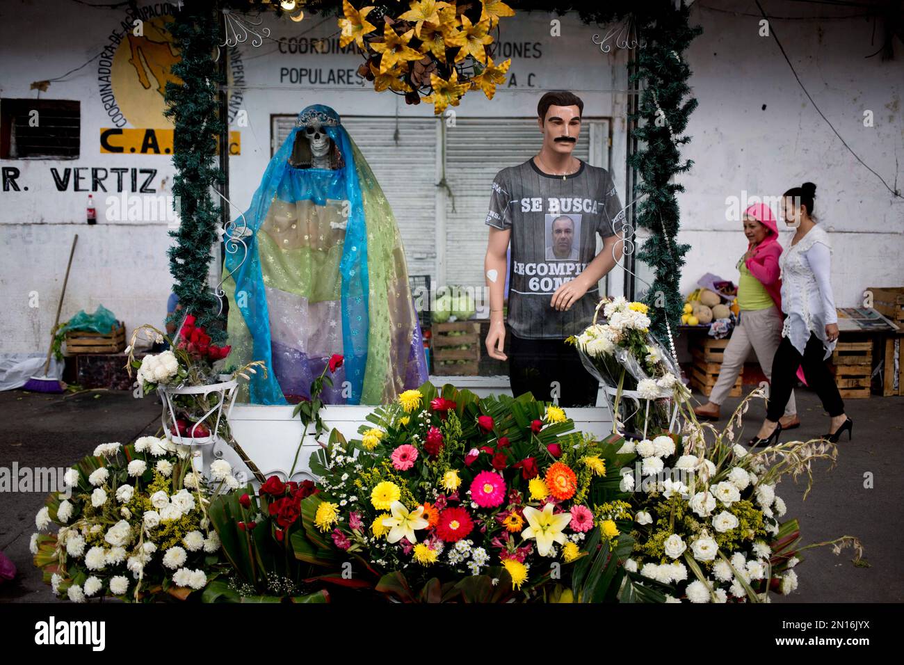 A street shrine with statues representing the folk saint known in ...