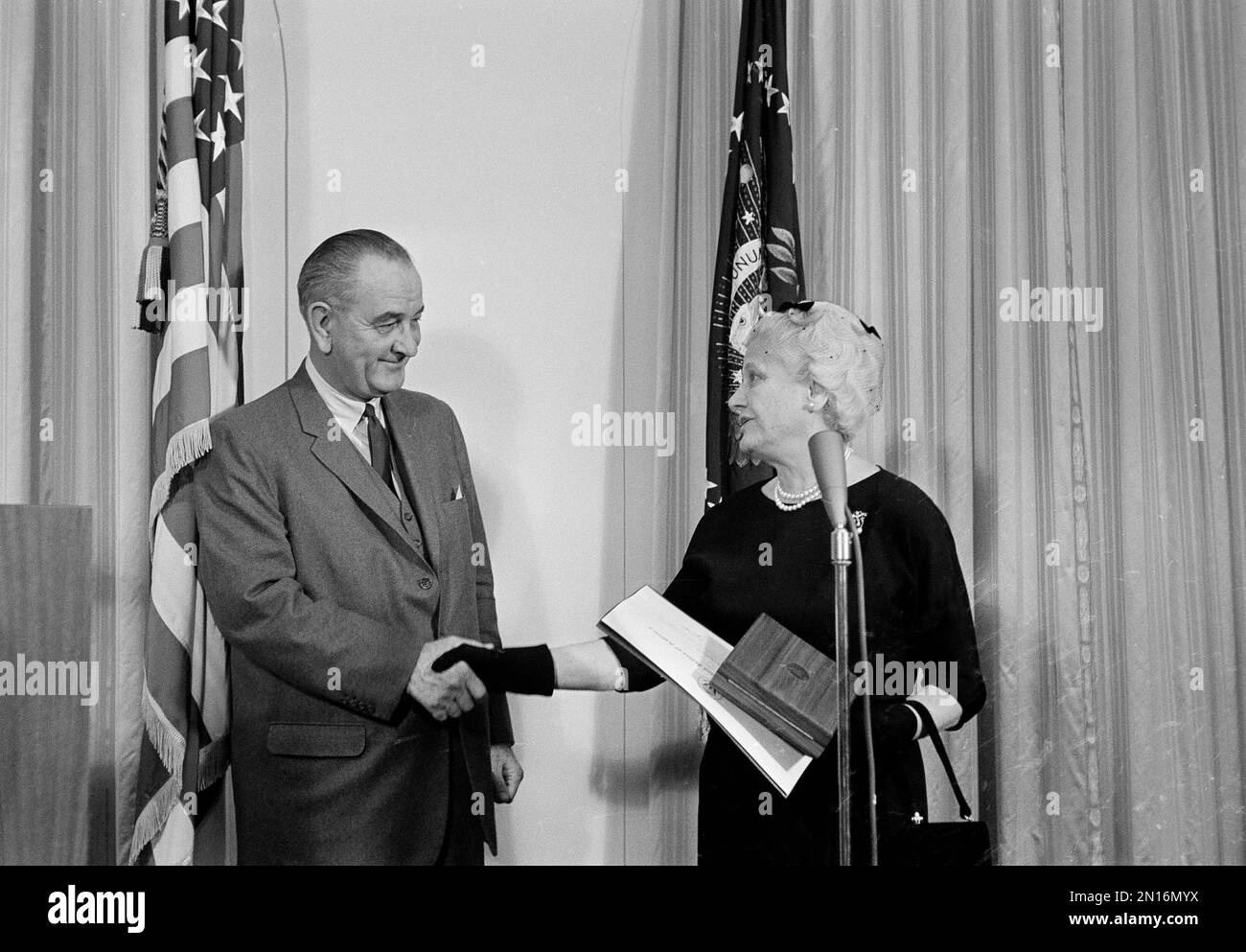 President Lyndon B. Johnson shakes the hand of Edith Louise Lehman ...