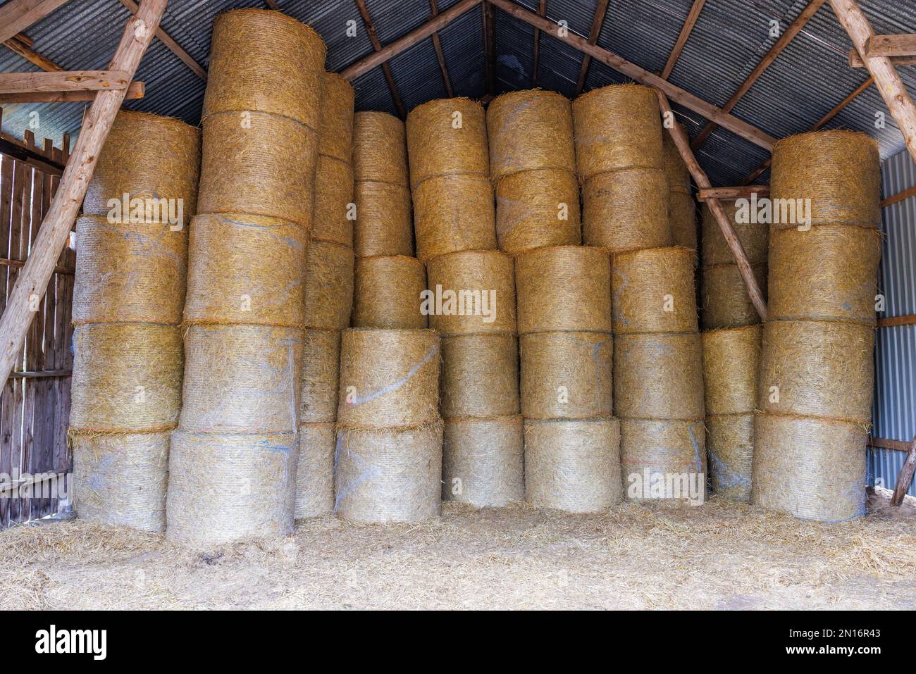 Bales stored in an old barn Stock Photo - Alamy