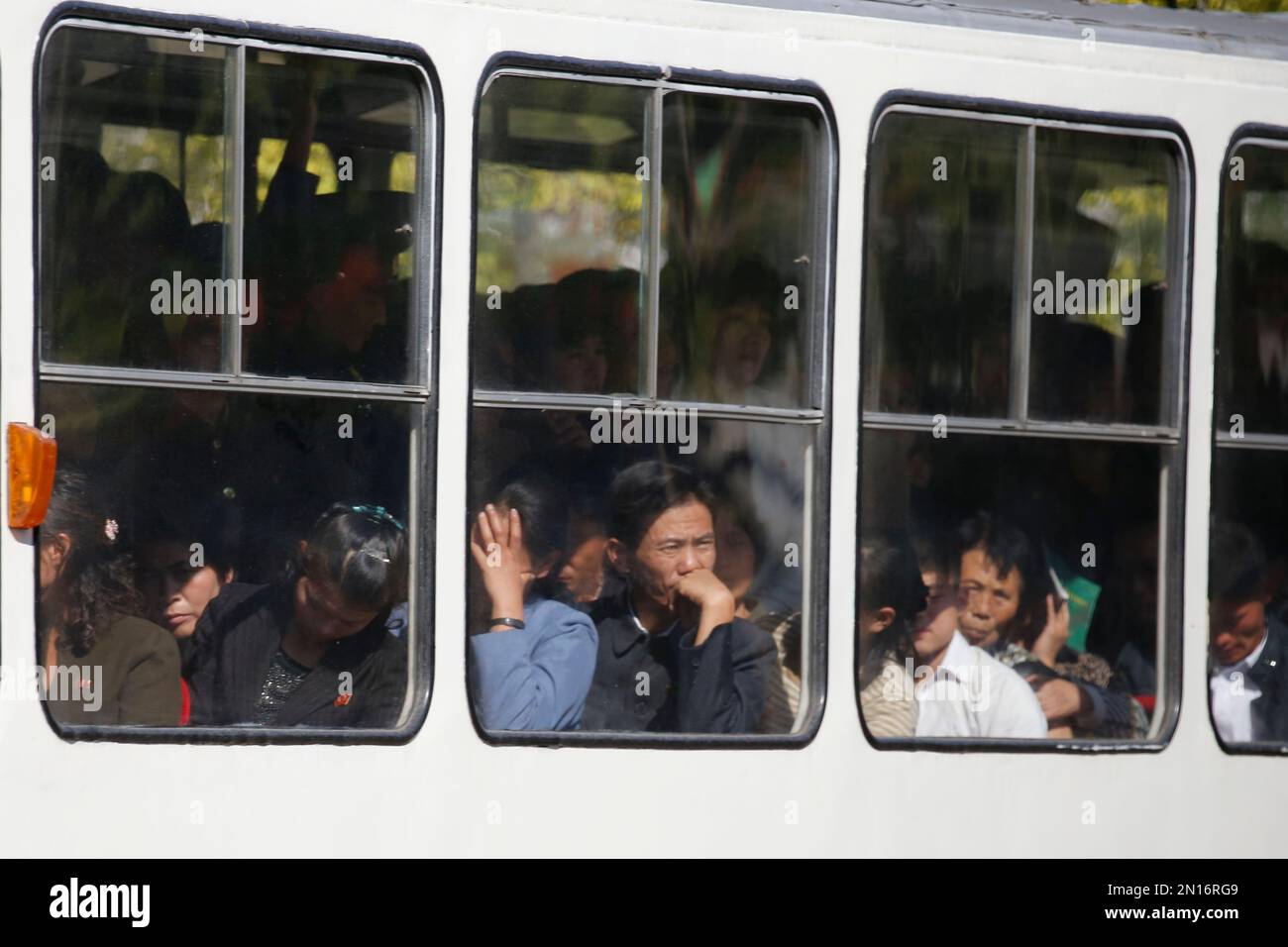 North Korean commuters use a trolleybus in Pyongyang, North Korea ...