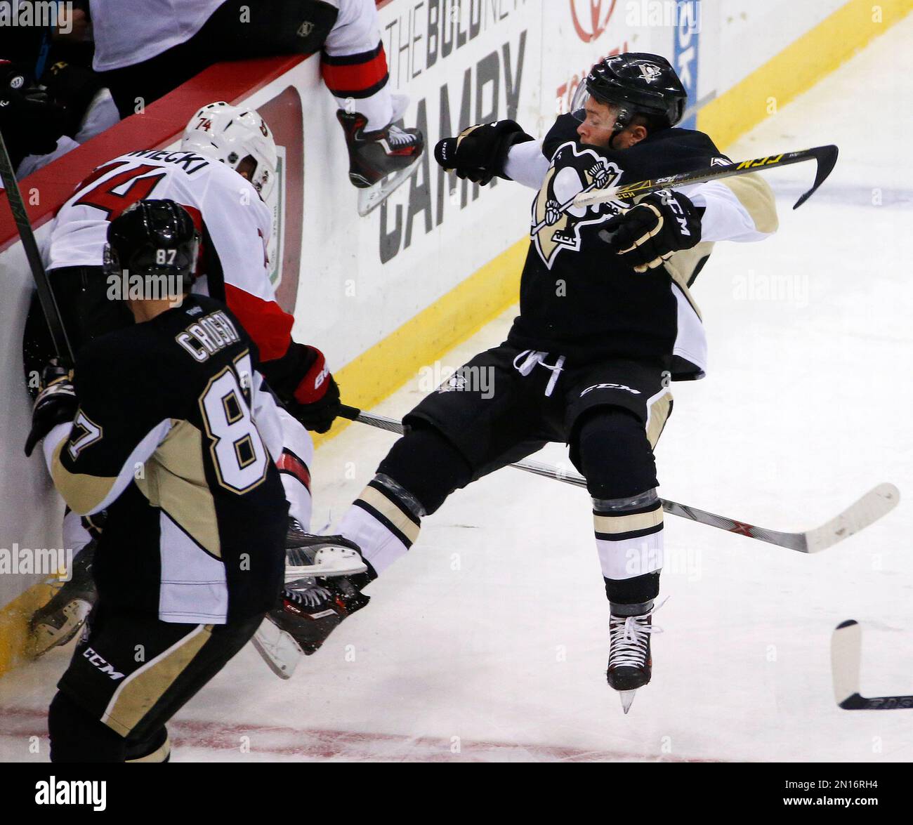 Pittsburgh Penguins' Bryan Rust, right, collides with Ottawa Senators ...