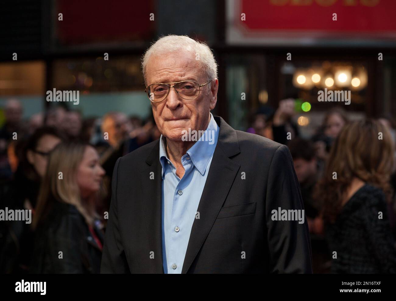 Actor Sir Michael Caine poses for photographers upon arrival at the ...