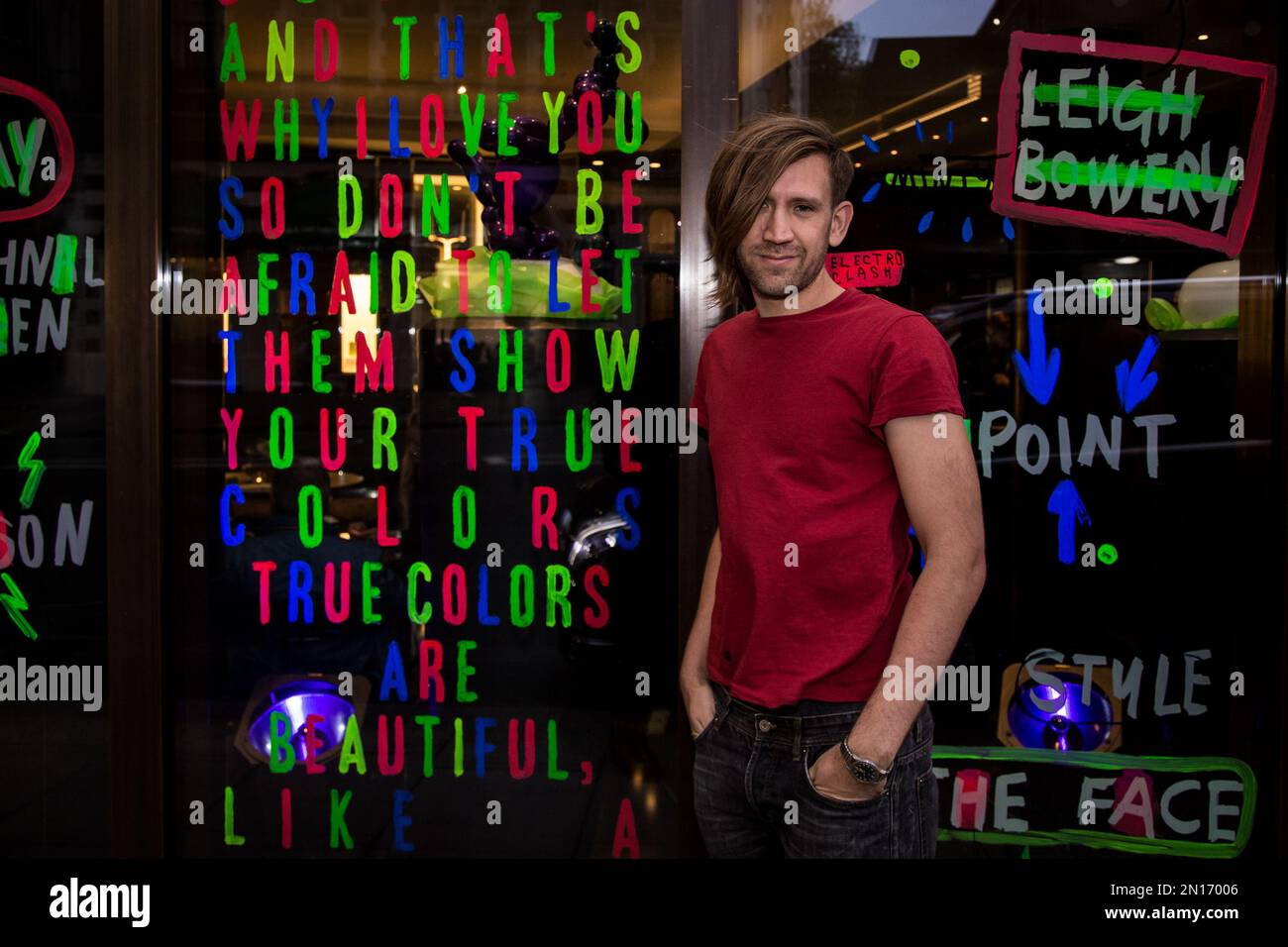 Stuart Semple poses in front of his artwork upon arrival at the Artist ...