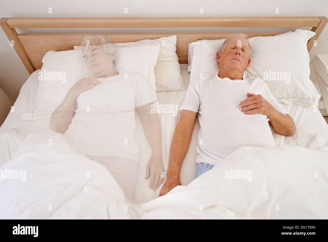 This is how they would always sleep. a elderly man lying next to his ...