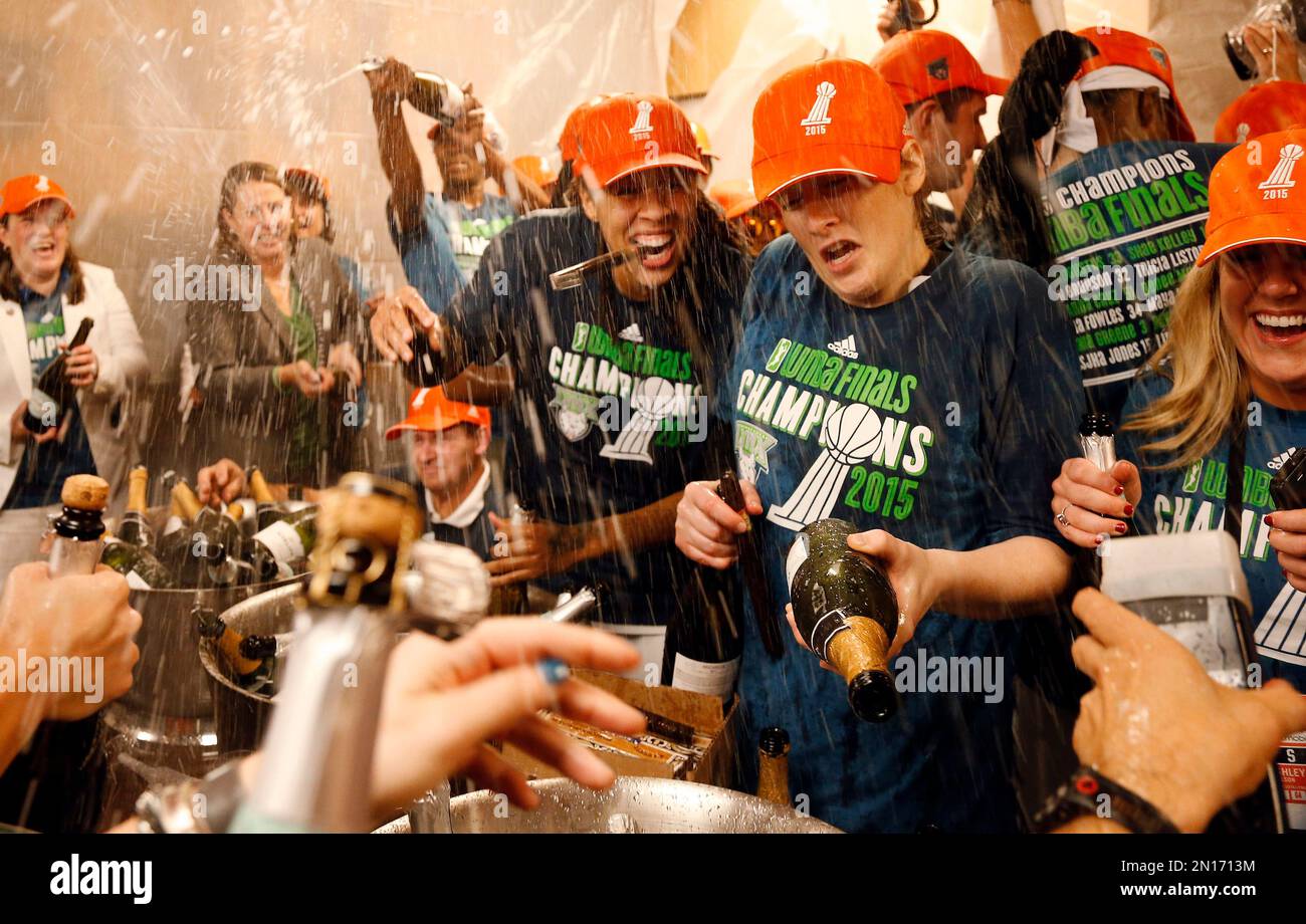 Minnesota Lynx players celebrate their championship in the locker room ...
