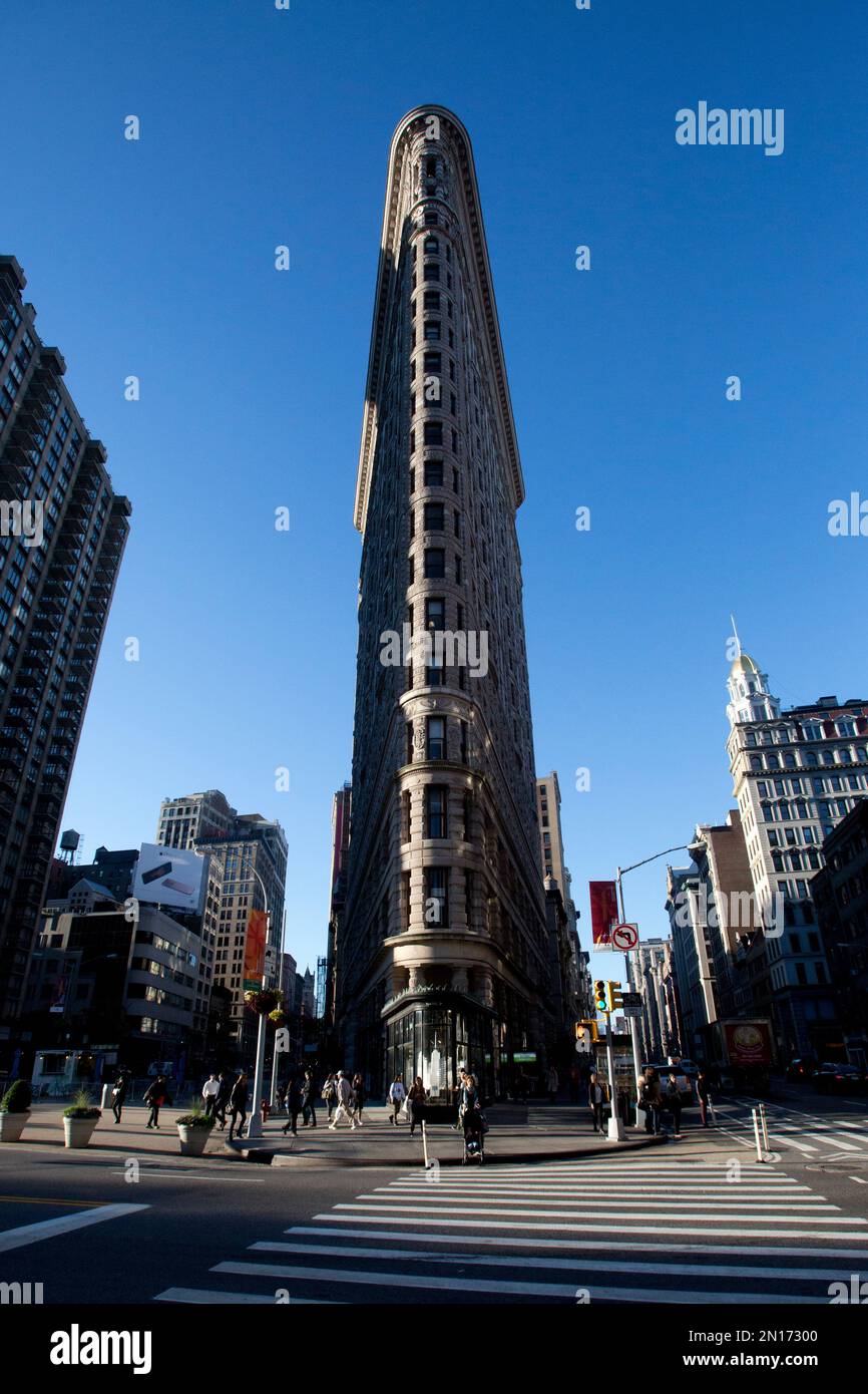 The Flatiron Building, a triangular 22-story steel-framed building, is ...