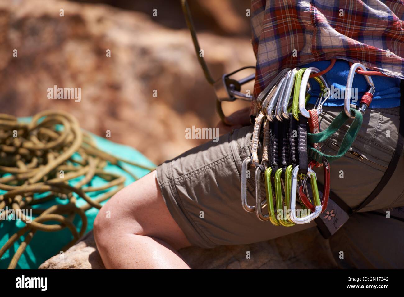 Shes got all her gear in place. a rock climber with her climbing gear ...