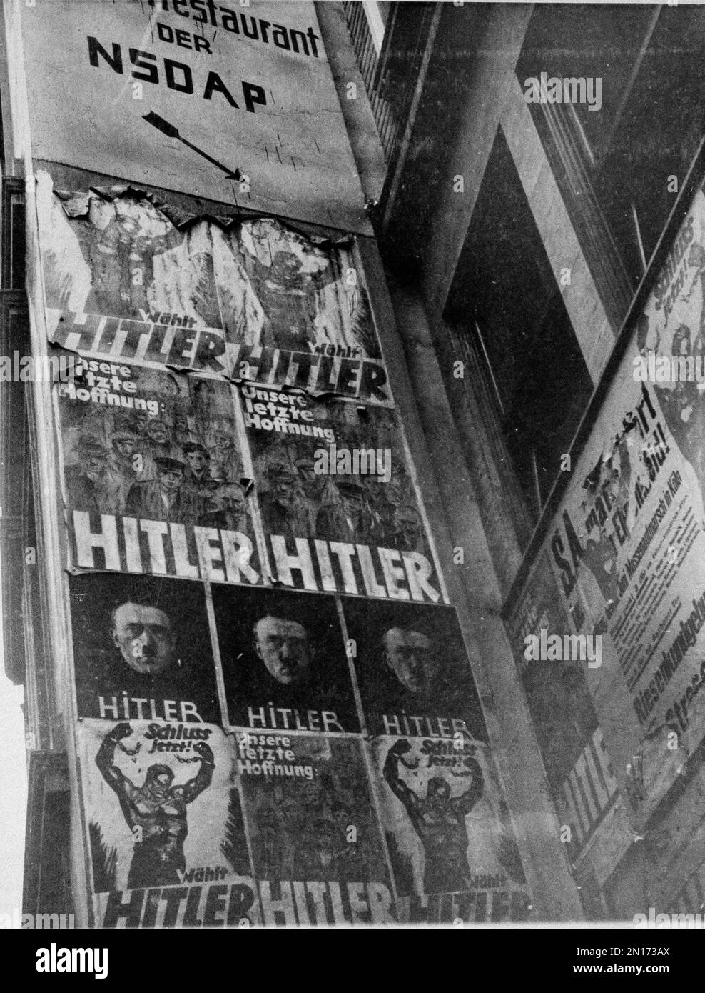 Propaganda posters made in 1932, before Hitler seized power, are seen ...