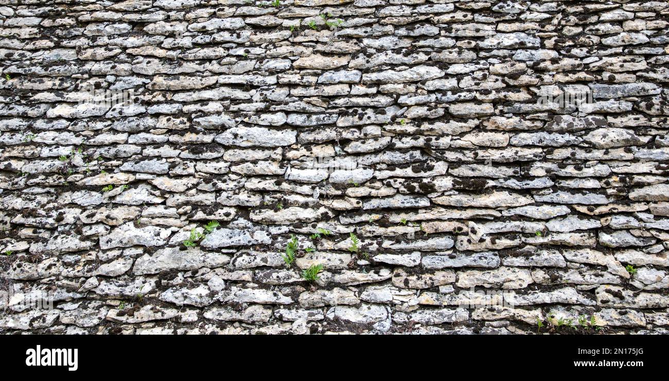 ancient grey tile stone wall background of house roof gray stones ...