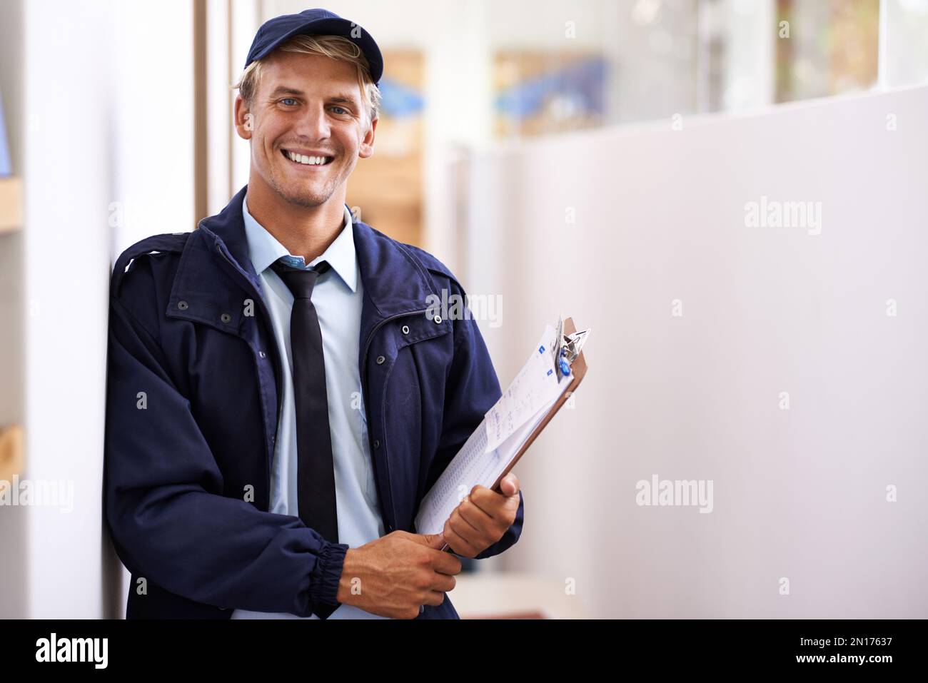 He provides a friendly and efficient service. a young man making a home ...