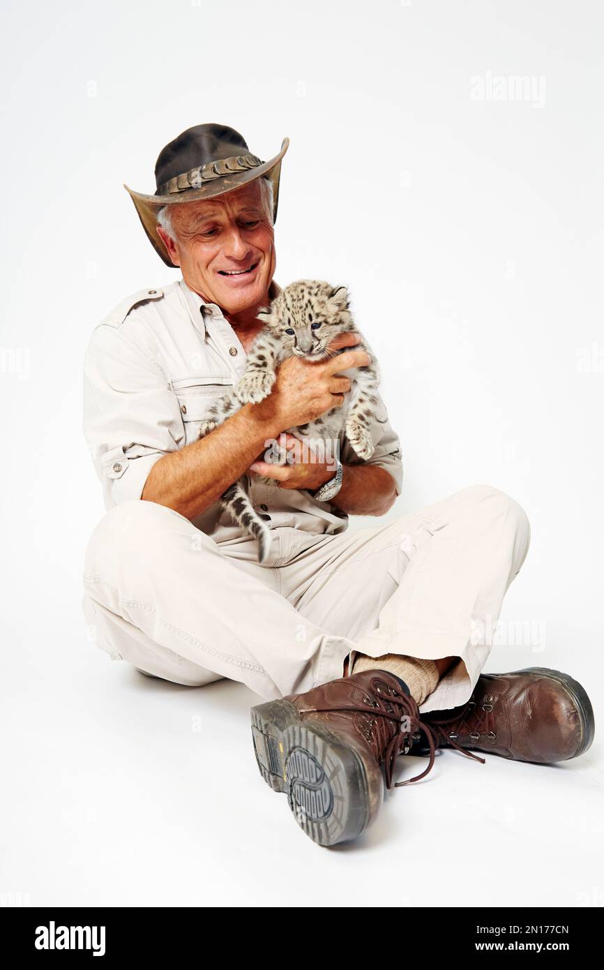 Jack Hanna poses for a portrait with a baby snow leopard on Monday, Oct ...