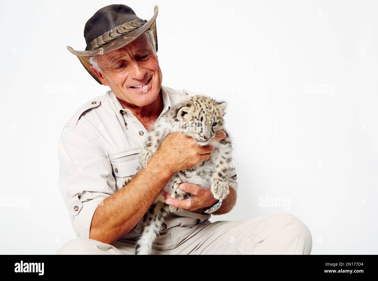 Jack Hanna poses for a portrait with a baby snow leopard on Monday, Oct ...