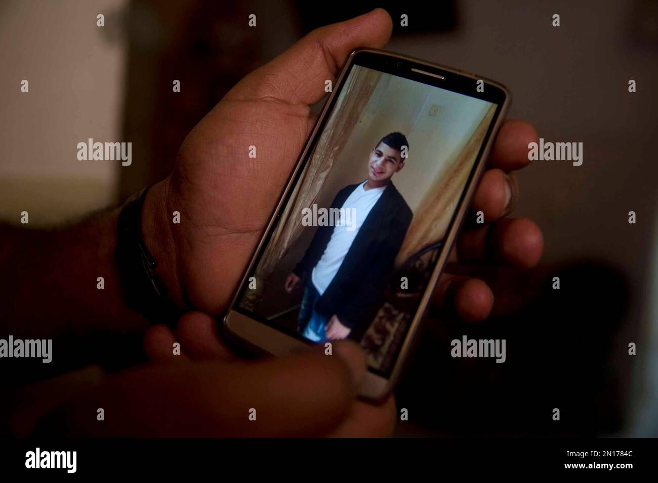 In this Monday, Oct. 12, 2015 photo, Ibrahim Abu Khalifeh shows a photo ...