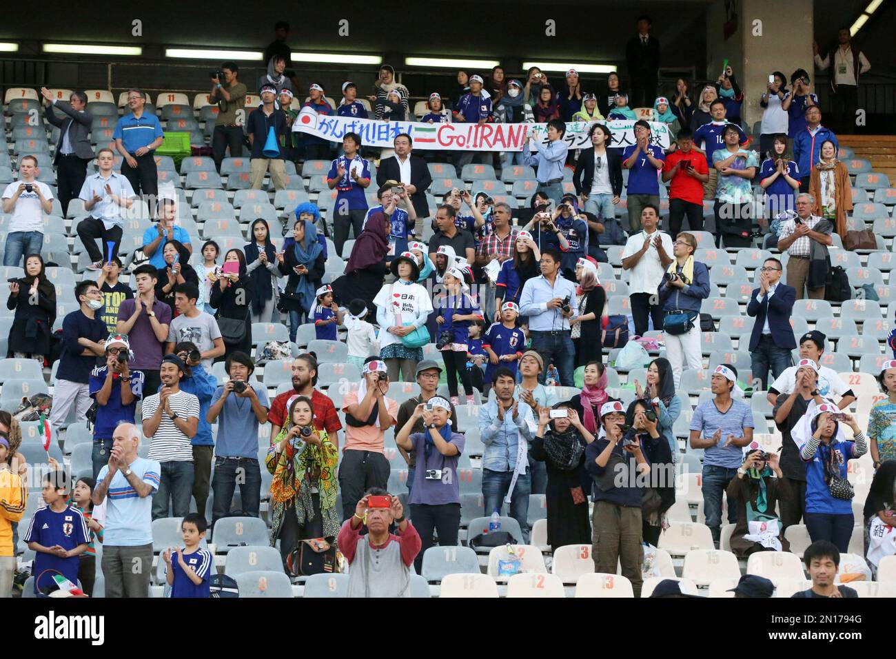 Japanese soccer fans wait for their national team to start a match with ...