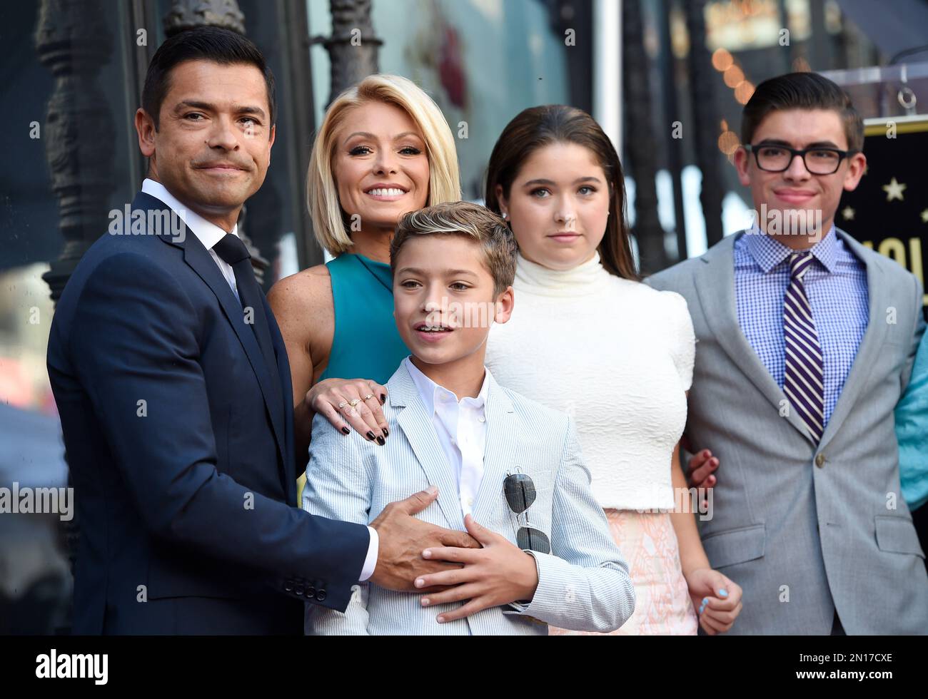 Television personality Kelly Ripa, second from left, poses with, from ...