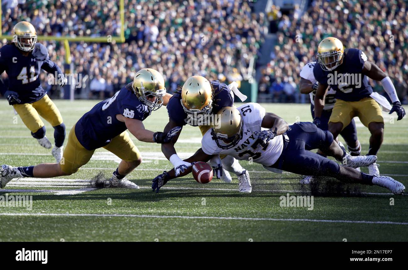 Navy fullback Chris Swain (37) tries to recover his fumble as Notre ...