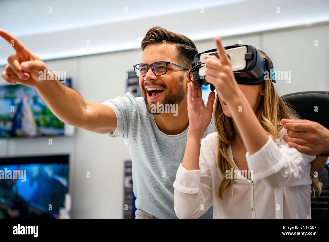 Group of people using virtual reality headset at exhibition, show. VR ...