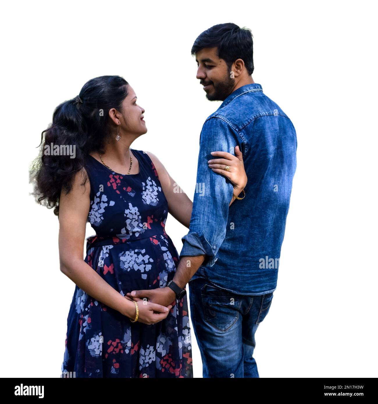 Indian couple posing for maternity baby shoot with white plain ...