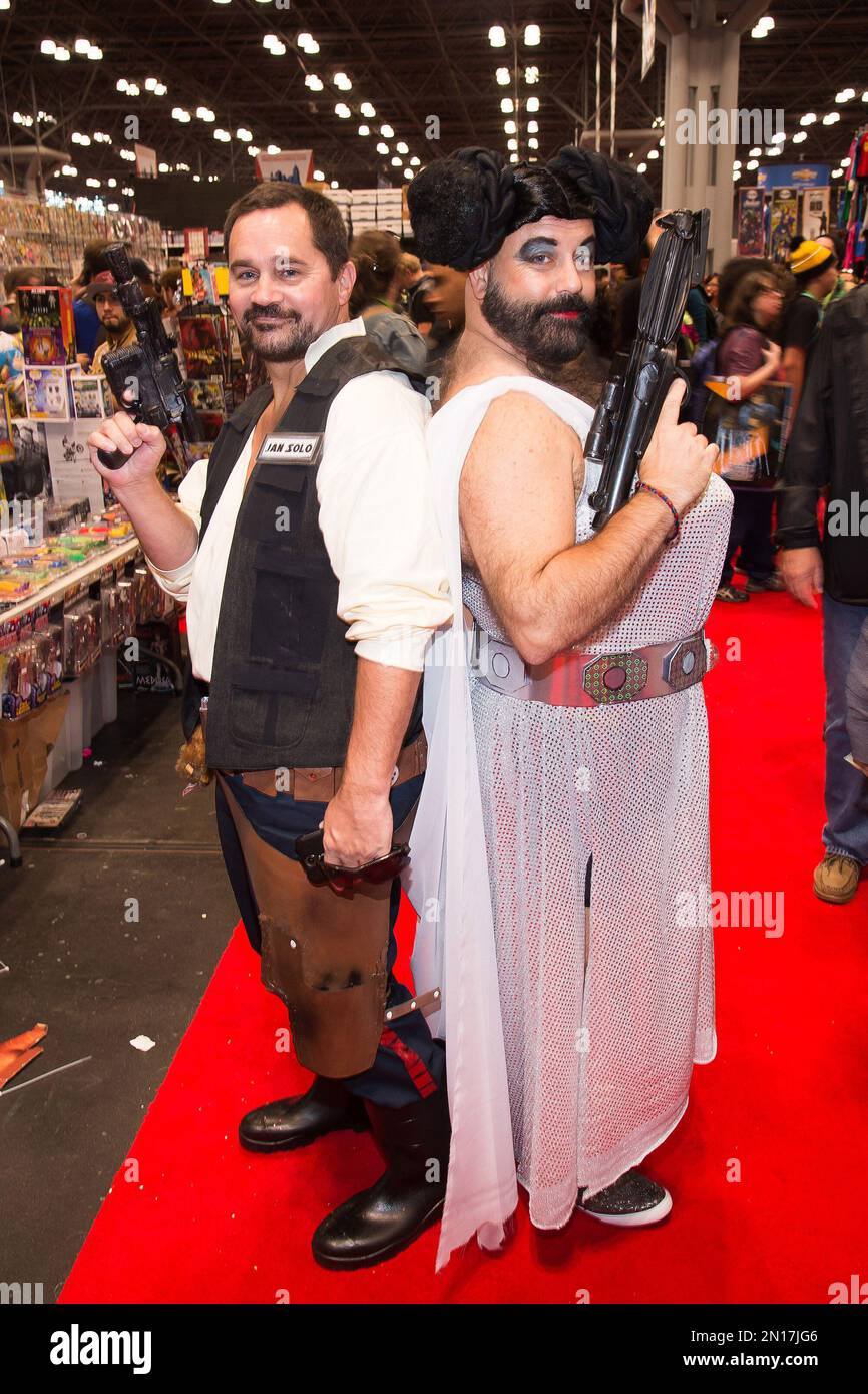 Attendees dressed as a "Star Wars" characters Han Solo and Princess ...