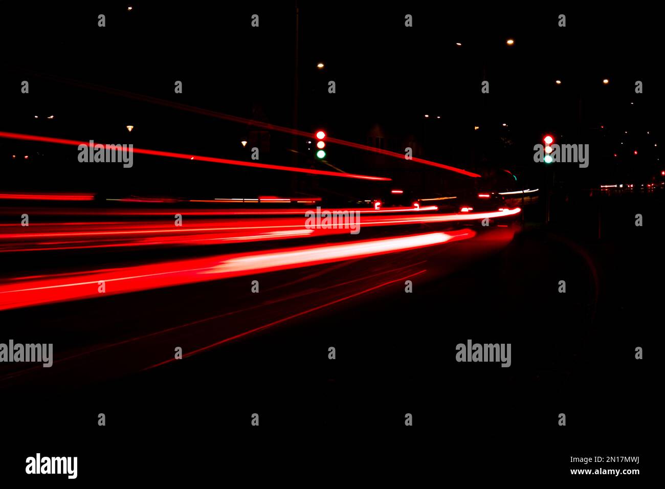 Lights of cars at night. Street line lights. Night highway city. Long ...