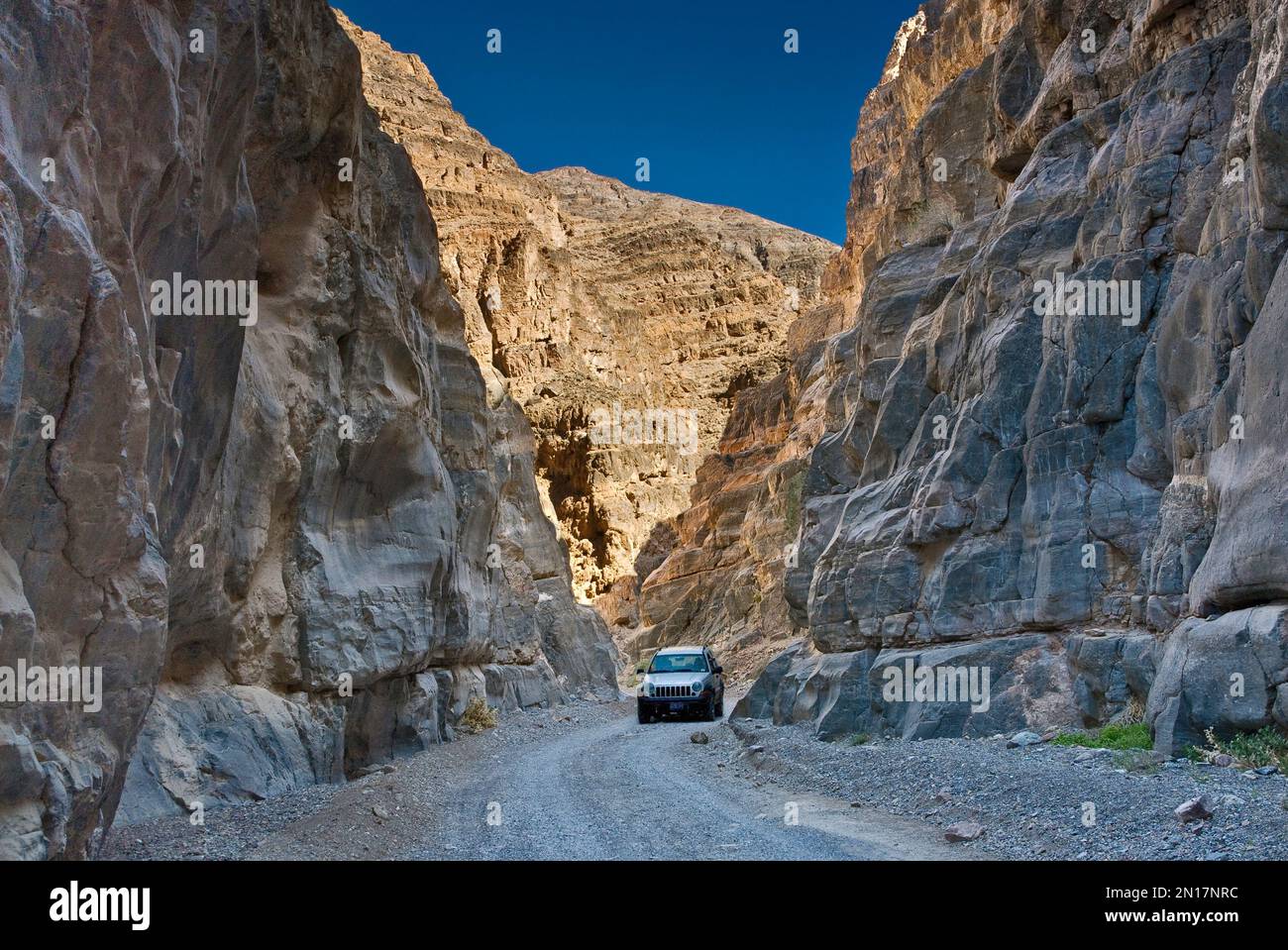 Car moving through the narrows of Titus Canyon in Grapevine Mountains ...