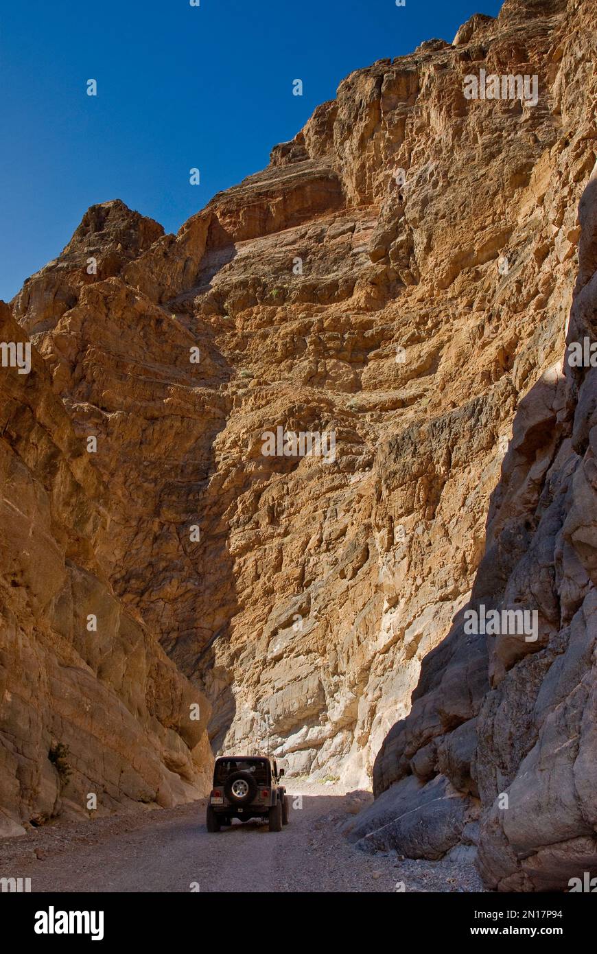 Car moving through the narrows of Titus Canyon in Grapevine Mountains ...