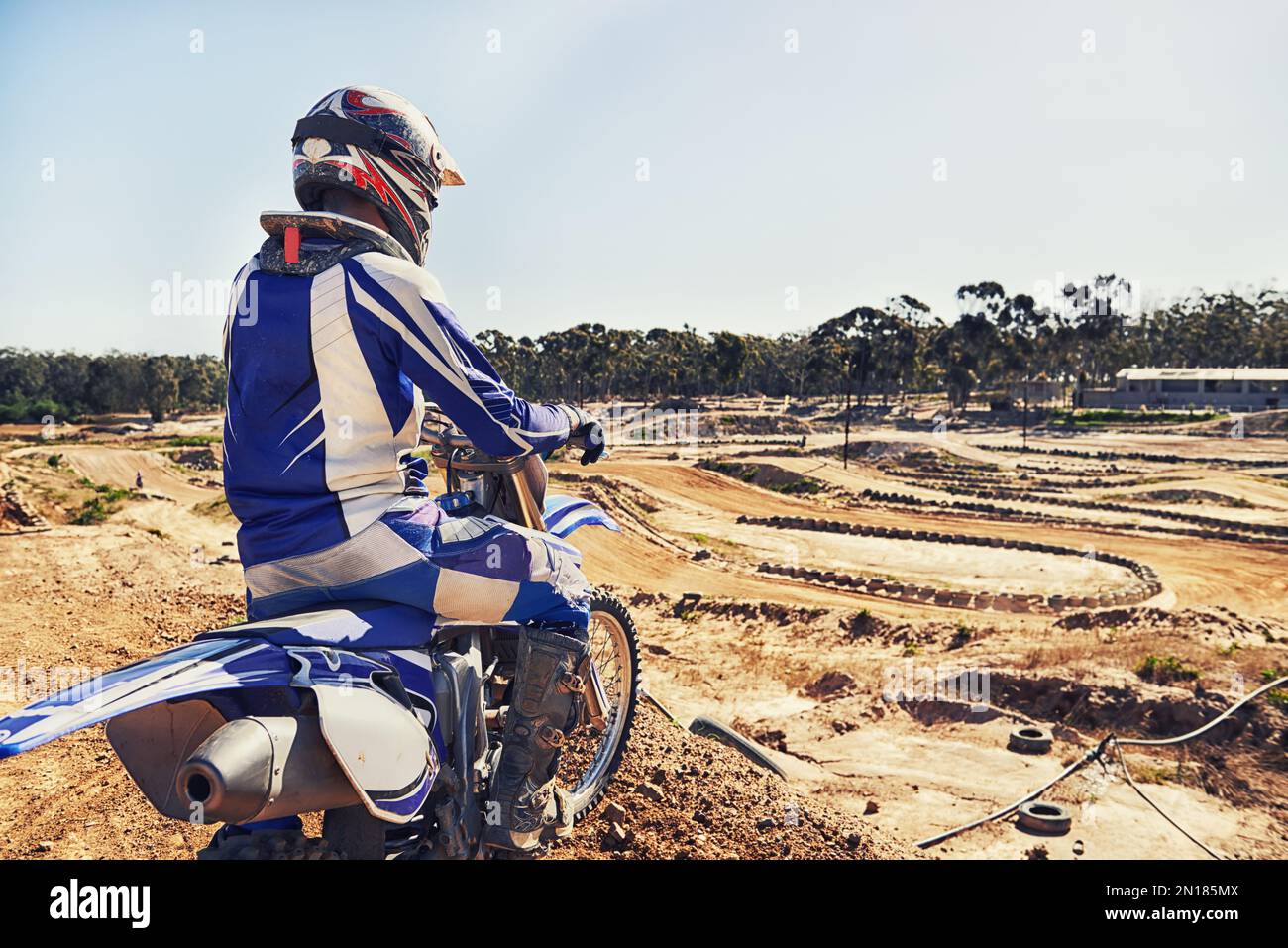 Time to rip up this track. motocross rider looking out over the track ...