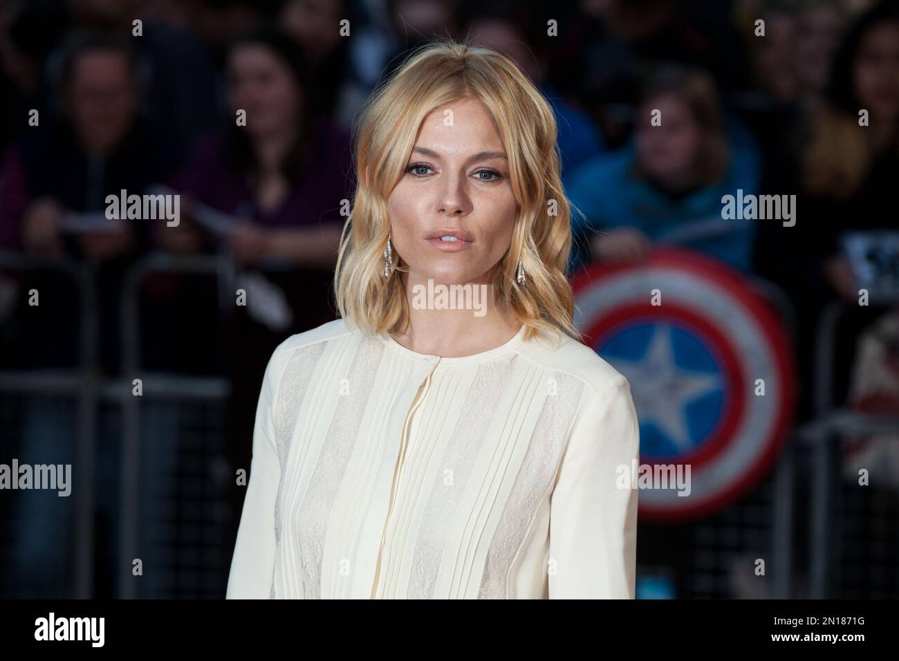 Actor Sienna Miller poses for photographers upon arrival at the ...