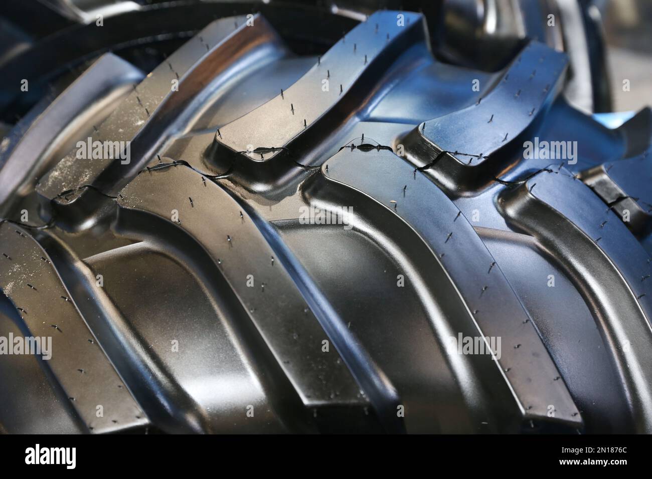 Details of tractor tire. Detail of large wheel. Heavy black wheel ...