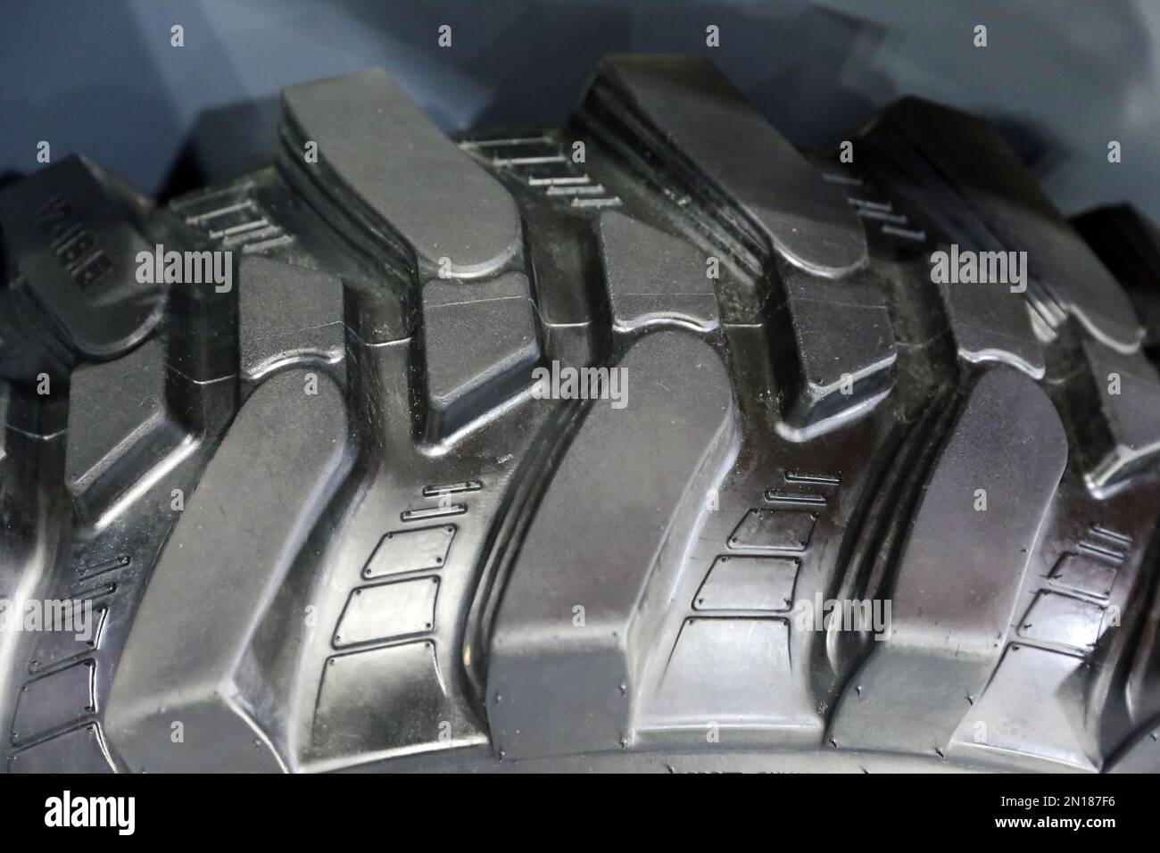 Details of tractor tire. Detail of large wheel. Heavy black wheel ...