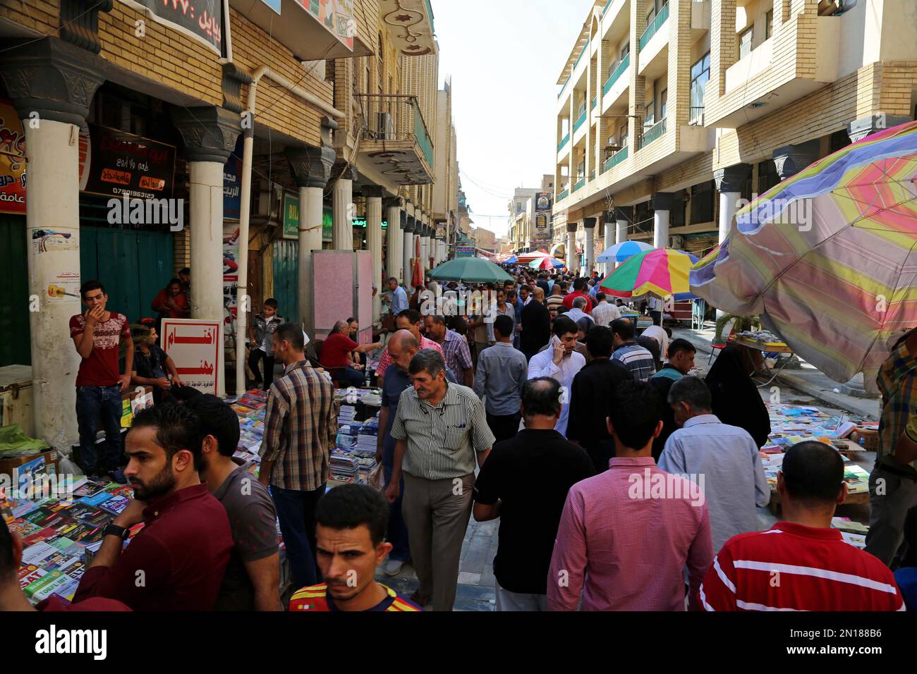 Iraqis shop for books on al-Mutanabi Street, home to the city's book ...