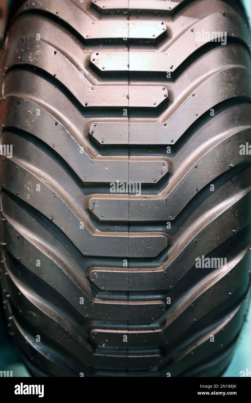 Details of tractor tire. Detail of large wheel. Heavy black wheel ...