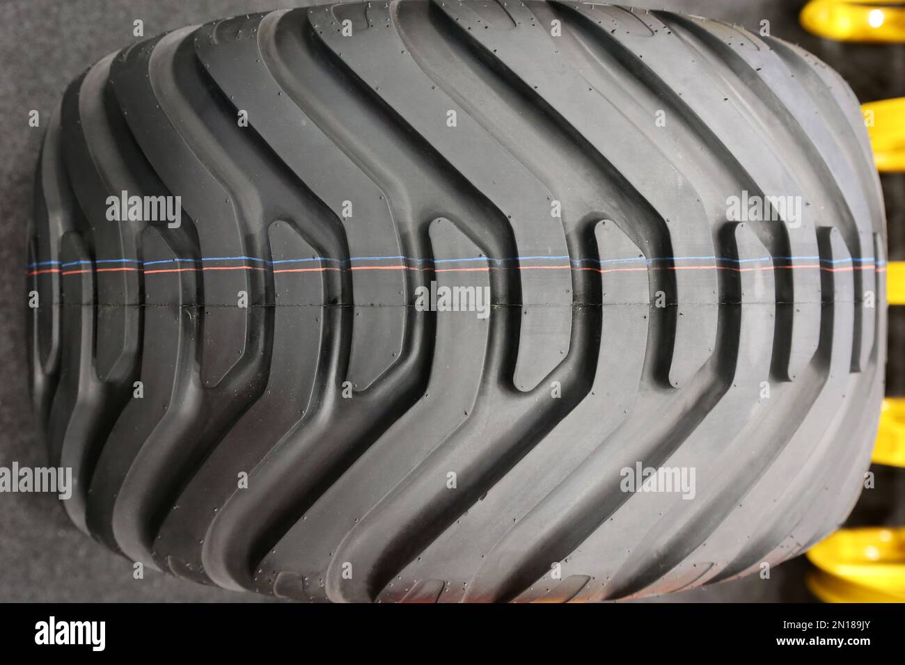 Details of tractor tire. Detail of large wheel. Heavy black wheel ...
