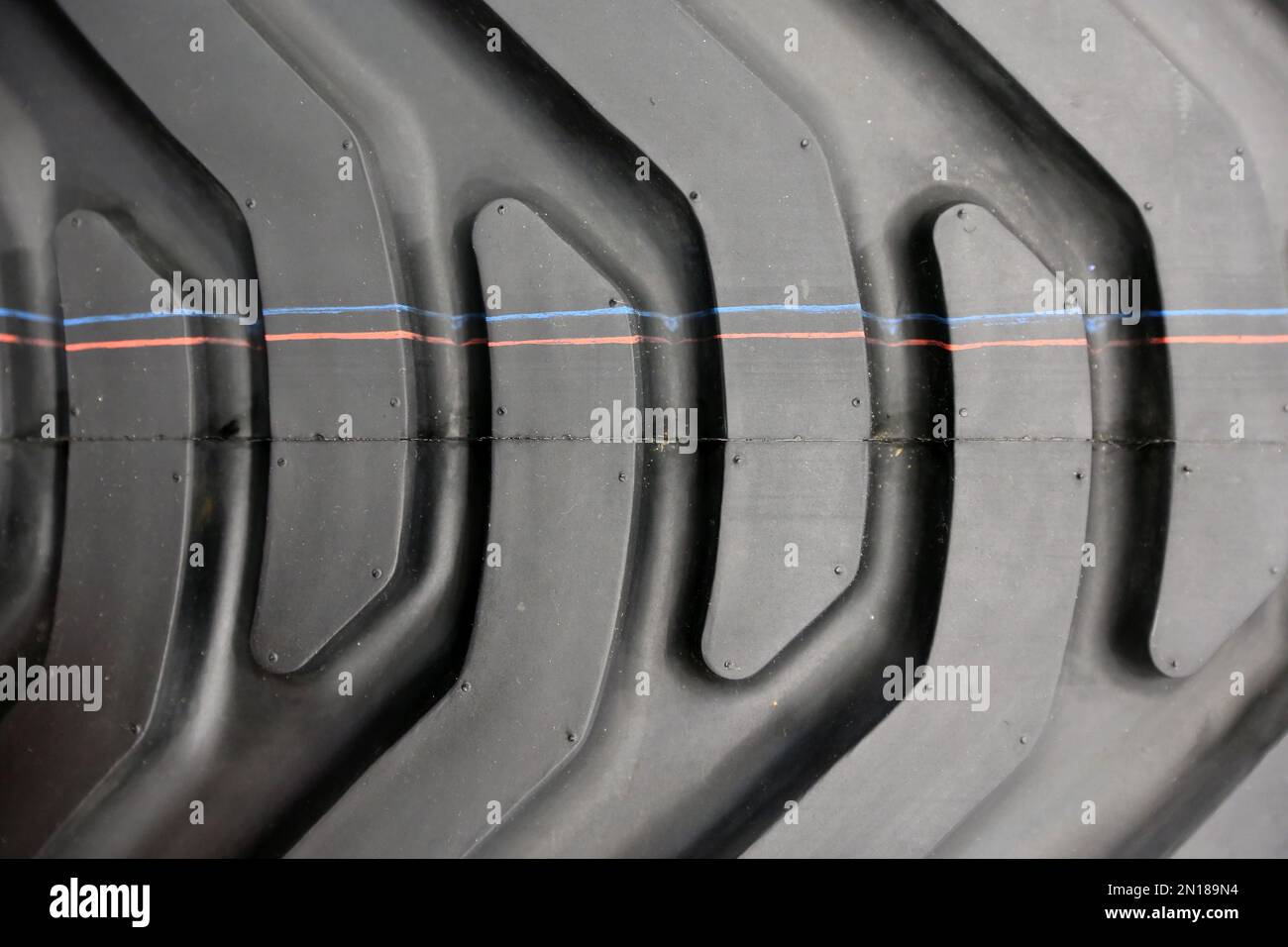 Details of tractor tire. Detail of large wheel. Heavy black wheel ...