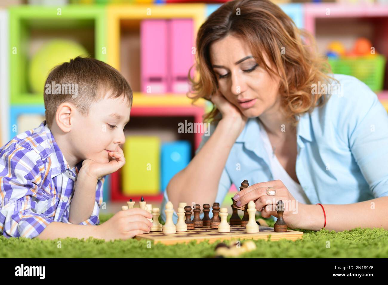Woman boy playing chess hi-res stock photography and images - Alamy