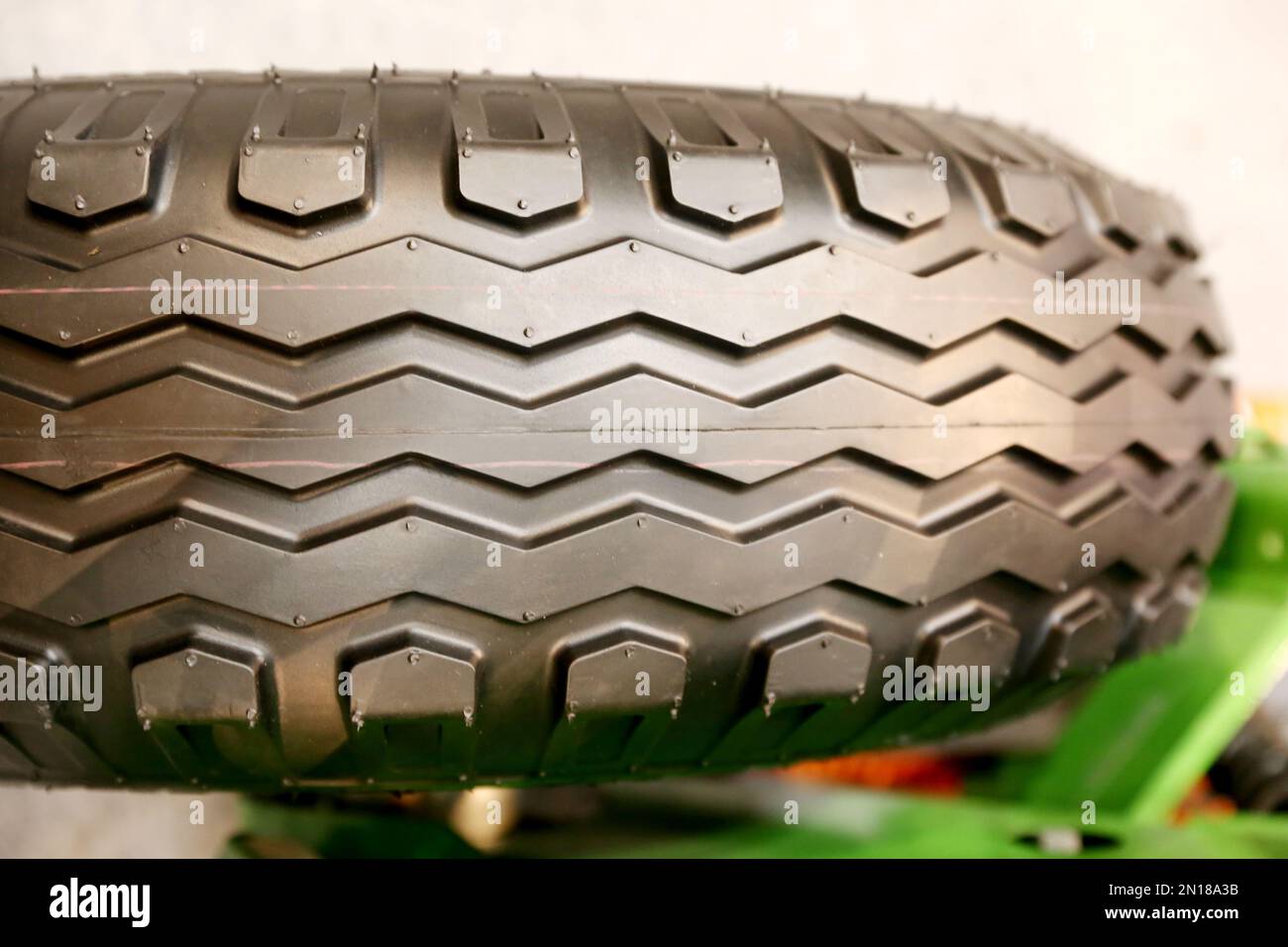 Details of tractor tire. Detail of large wheel. Heavy black wheel ...