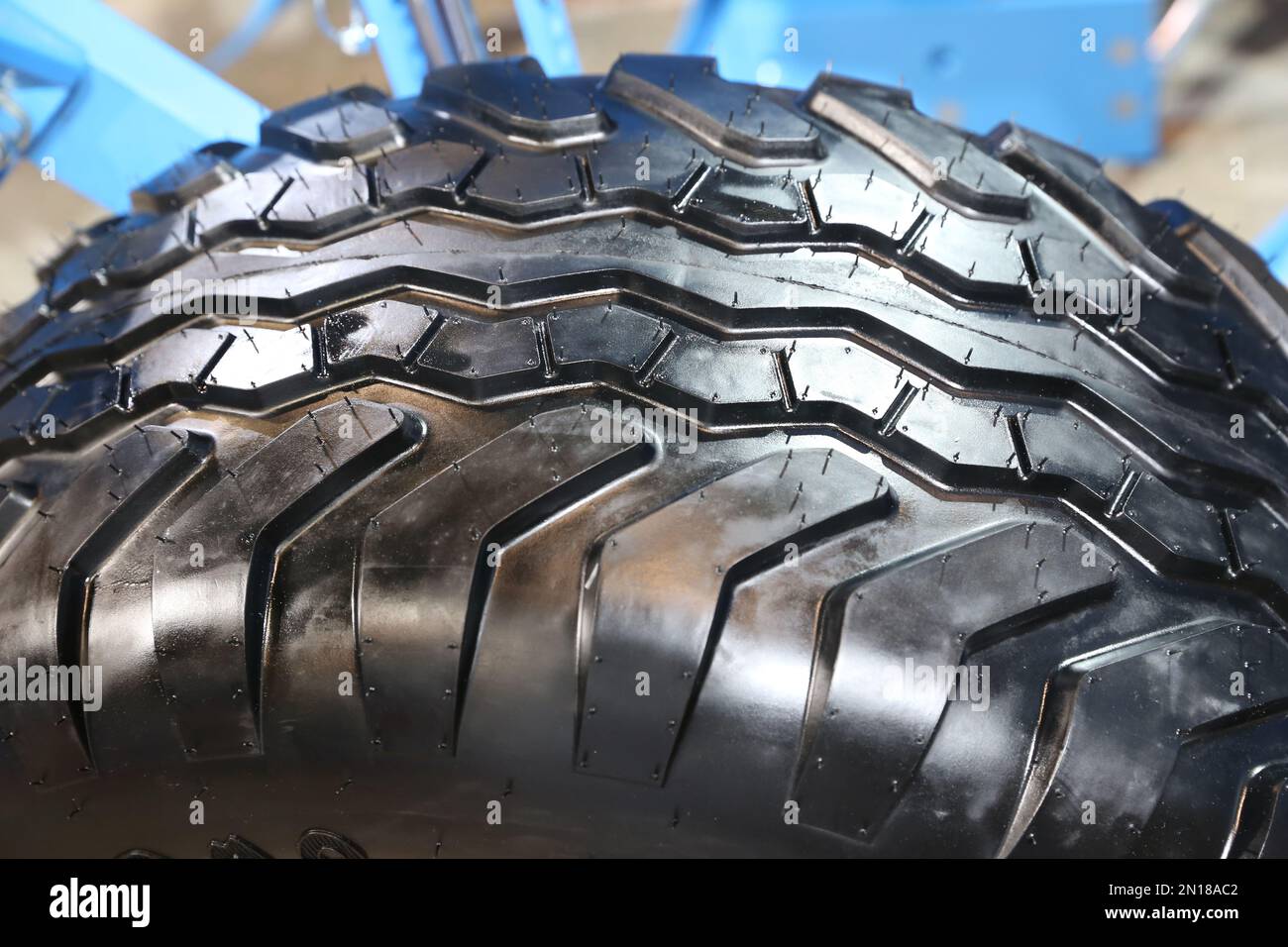 Details of tractor tire. Detail of large wheel. Heavy black wheel ...