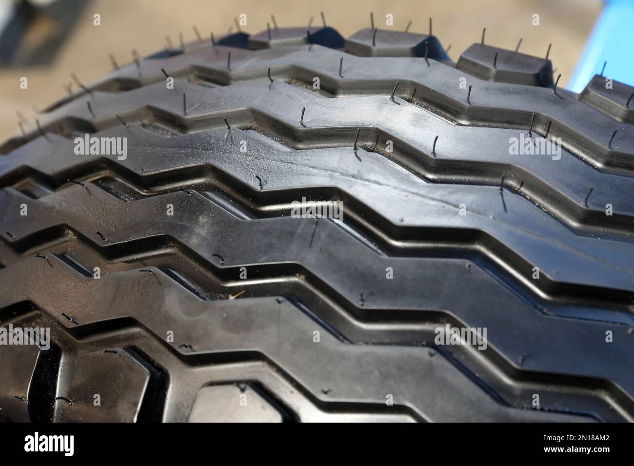 Details of tractor tire. Detail of large wheel. Heavy black wheel ...