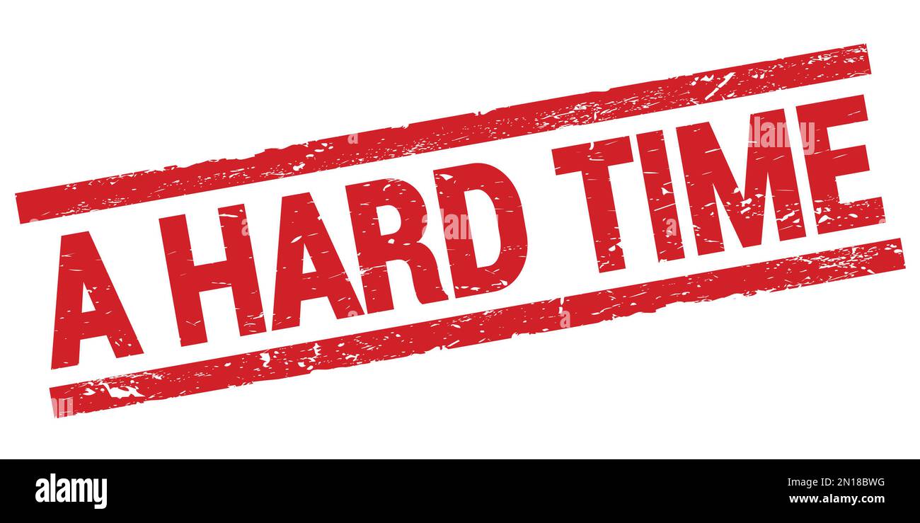 A HARD TIME text written on red rectangle stamp sign Stock Photo - Alamy