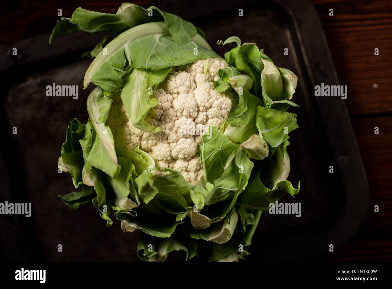 Whole cauliflower on a dark background. Vegetarian concept, healthy ...