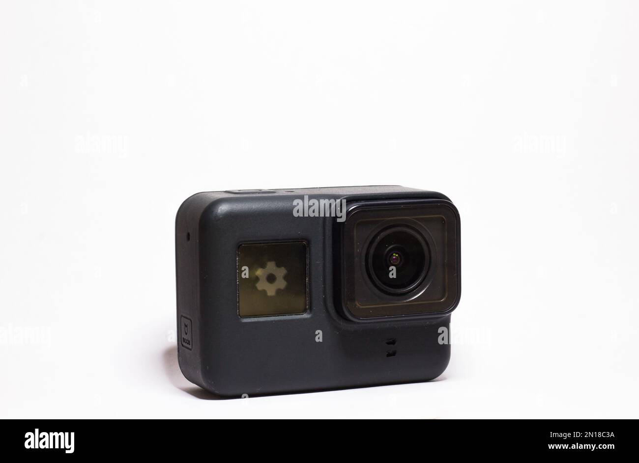 A GoPro Hero 7 black action 4K Camera with cover case on a white ...